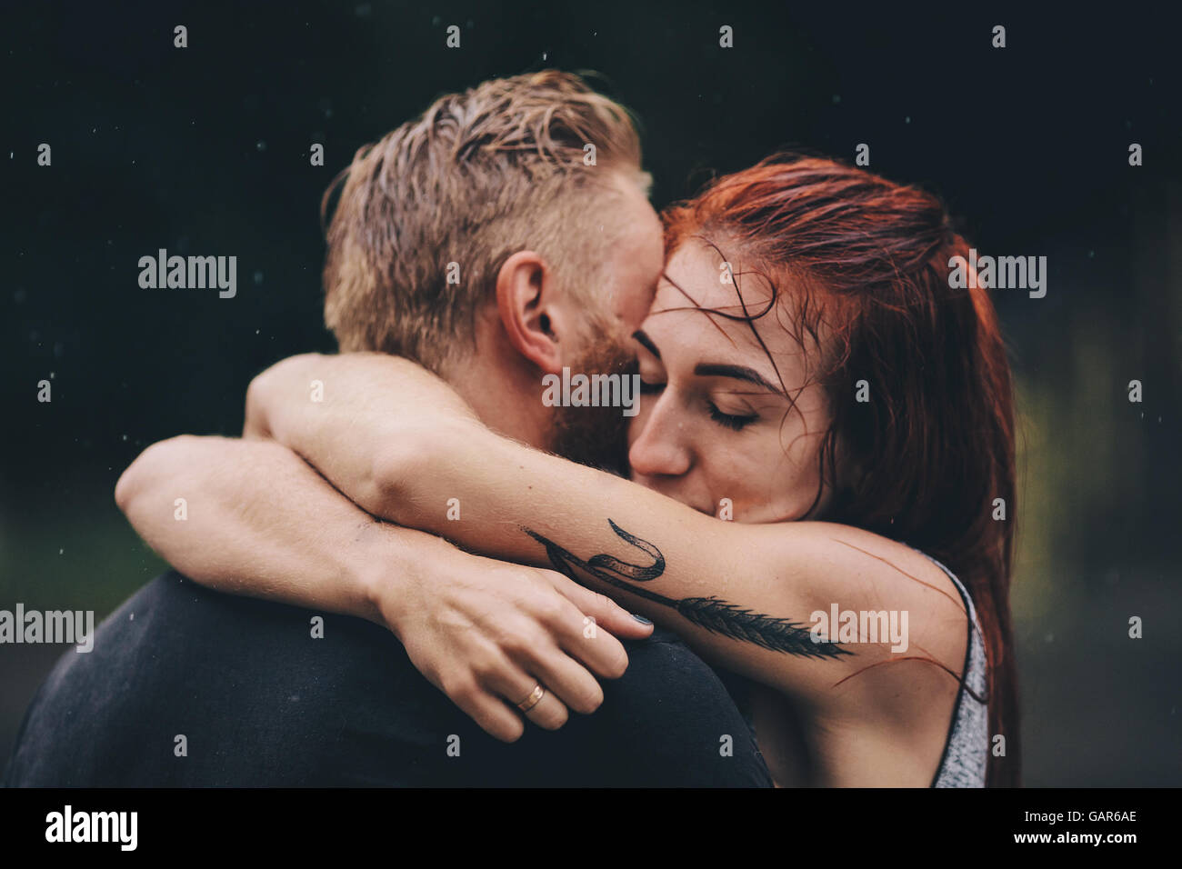 beautiful couple hugging in the rain Stock Photo - Alamy