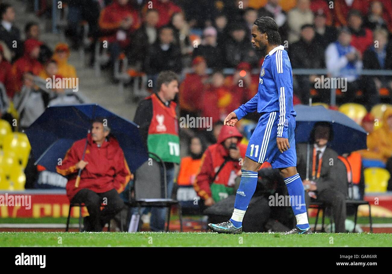 Chelsea's Didier Drogba walks off the field dejected, after being shown ...