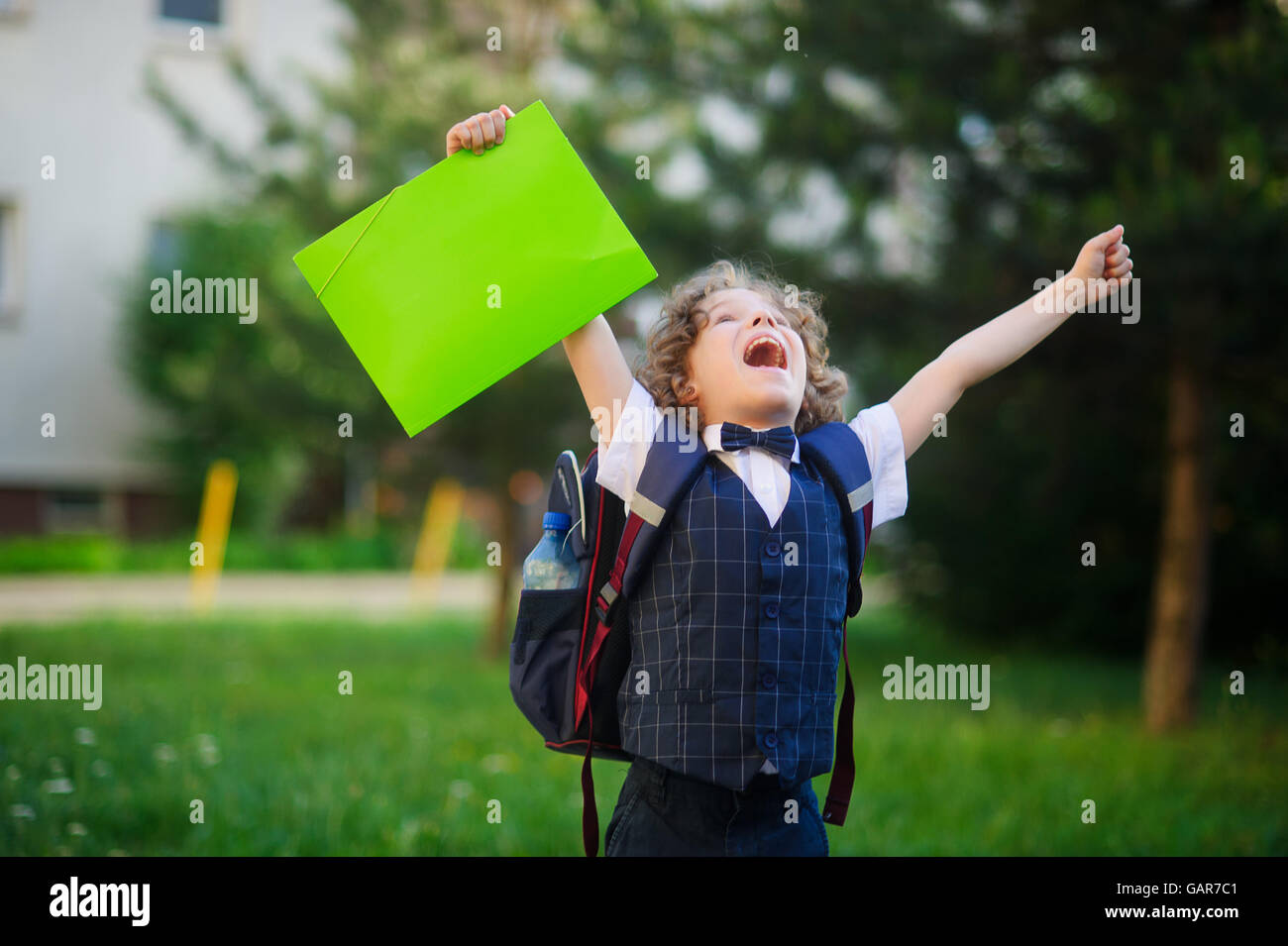 Schoolboy very angry. This elementary school student. The boy lifted up ...