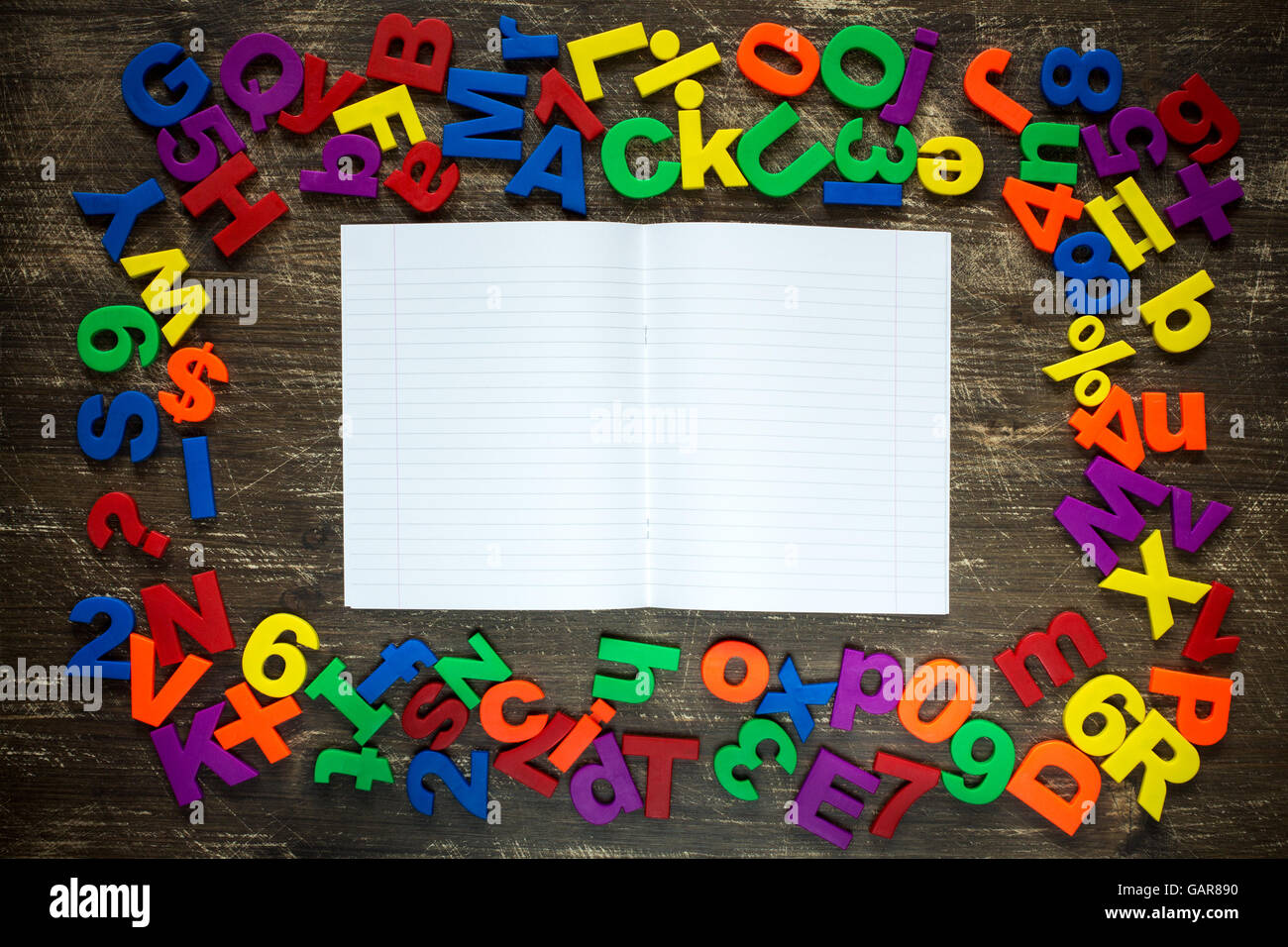 Open exercise-book with colorful letters and numbers.Copy-space Stock ...