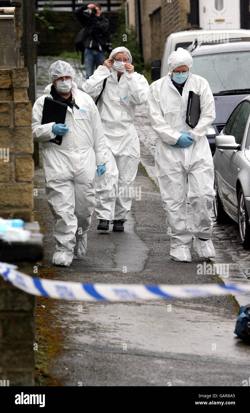Forensic officers at a scene in Bradford where a 31 year old man was ...