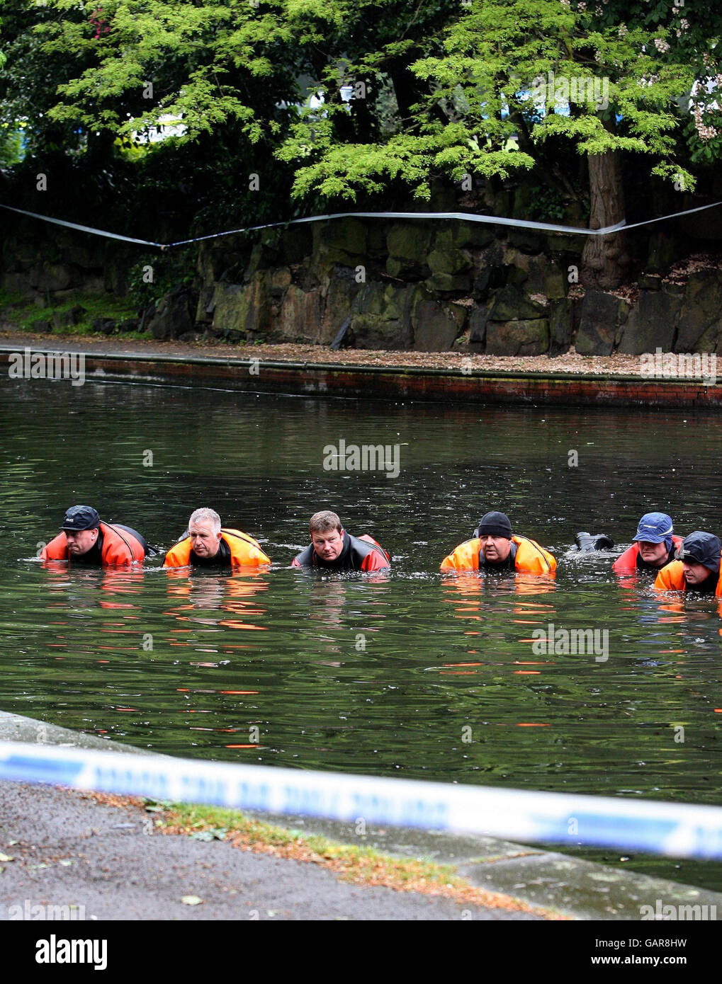 Police officers search Crows Nest Park in Dewsbury, where teenager Amar ...