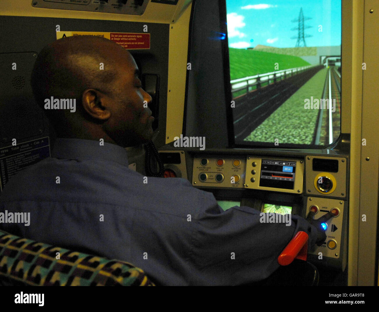 A London underground train driver uses one of the upgraded train ...