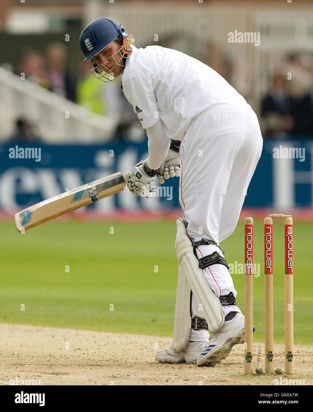 England's Stuart Board looks back at his stumps after being bowled by ...