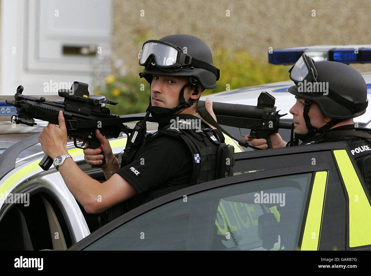 Armed Police in house siege Stock Photo - Alamy