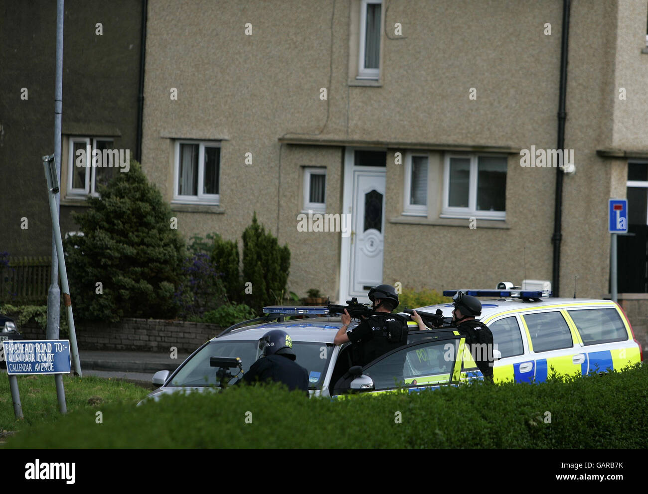 Armed Police in house siege Stock Photo - Alamy