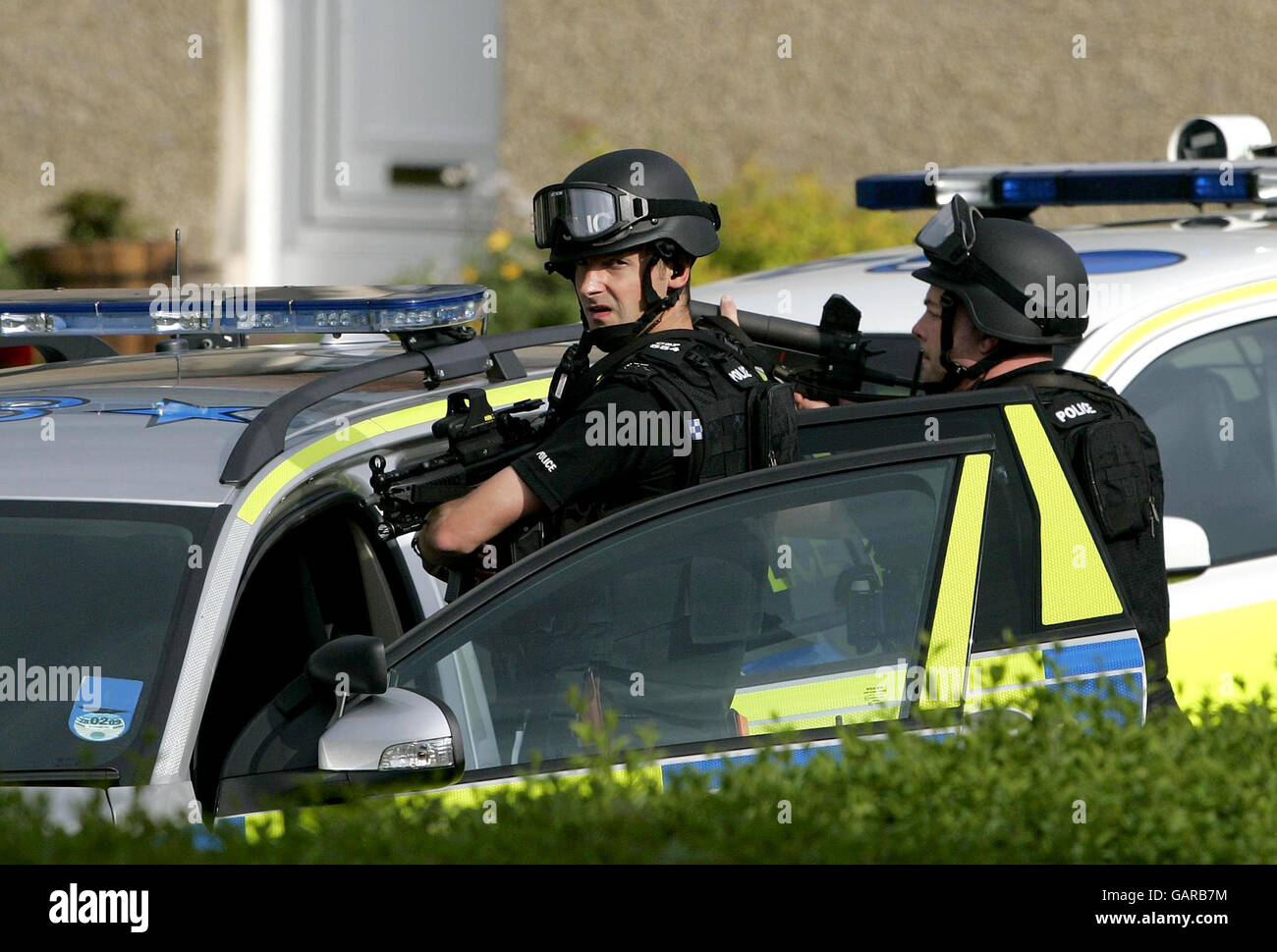 Armed Police in house siege Stock Photo - Alamy