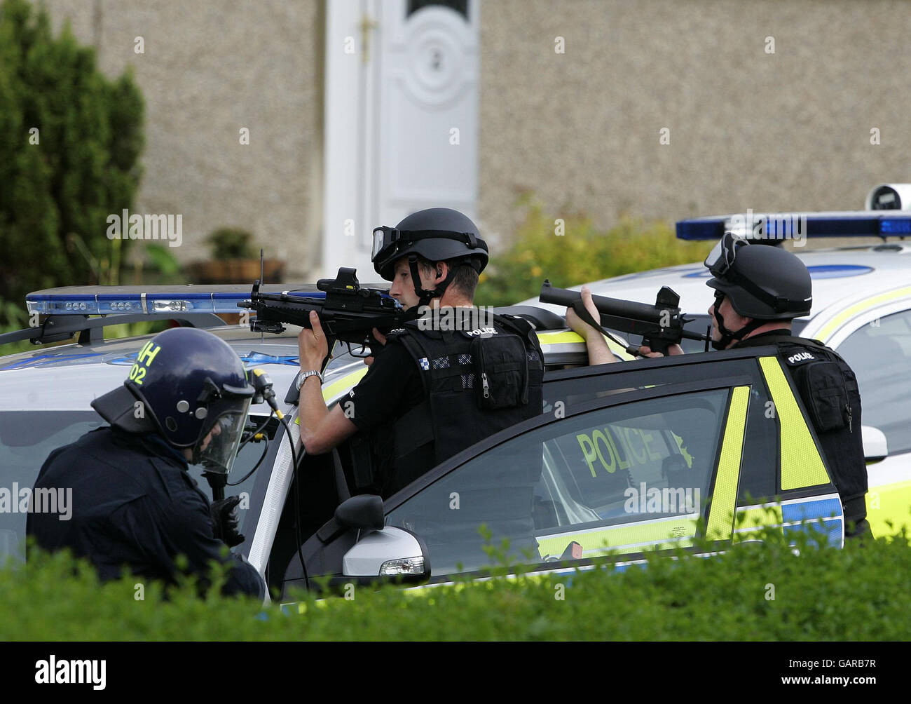 Armed Police in house siege Stock Photo - Alamy