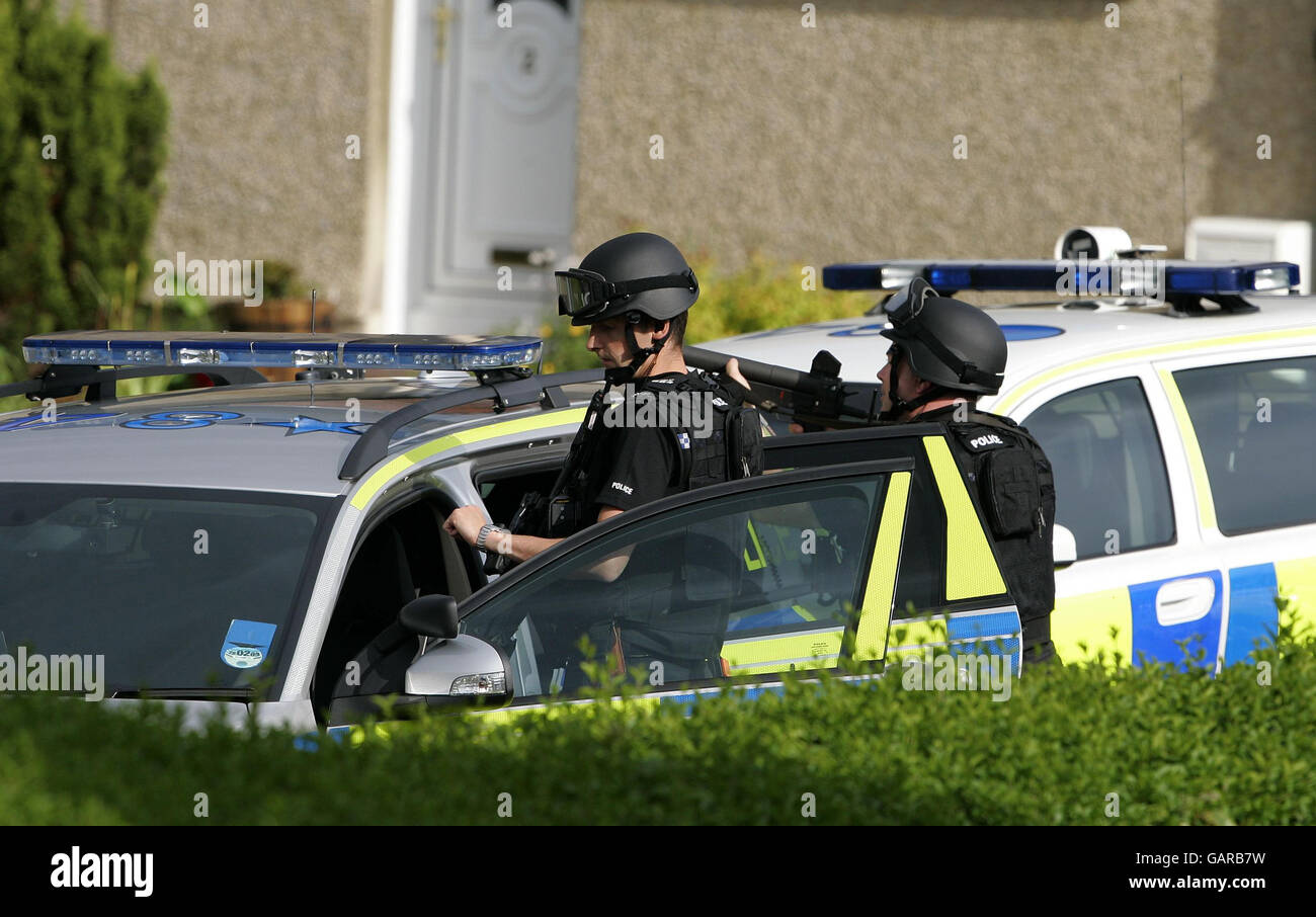 Armed Police in house siege Stock Photo - Alamy