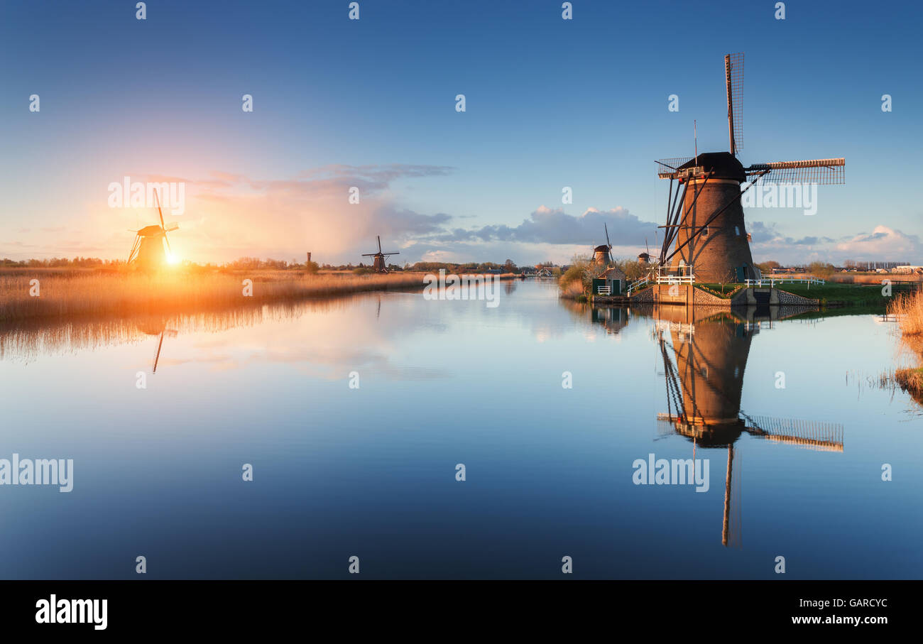 Beautiful traditional dutch windmills near the water channels with ...