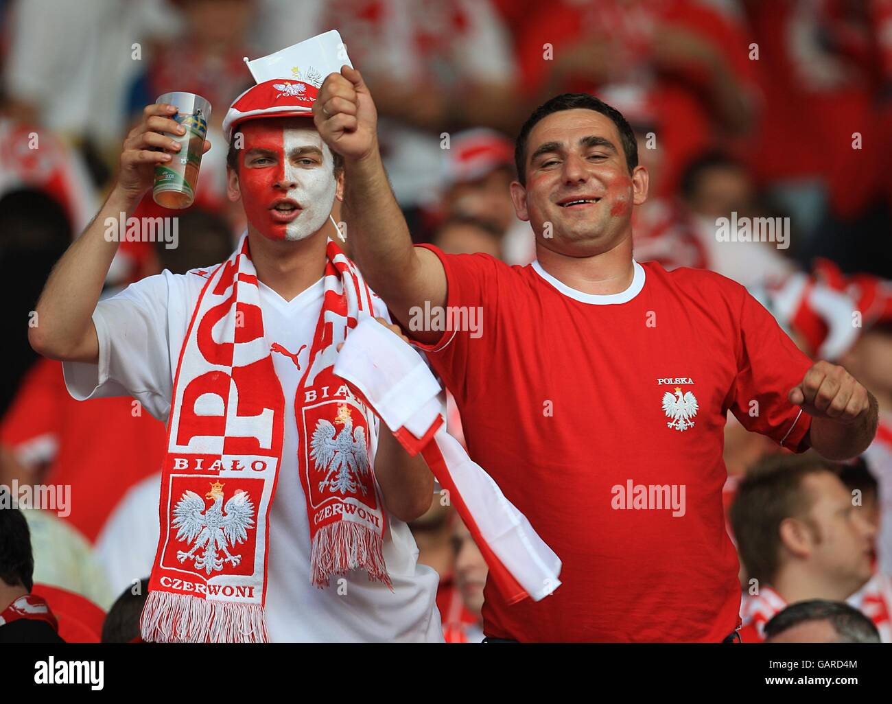 Two Polish fan show their support and colours in the stands before kick ...