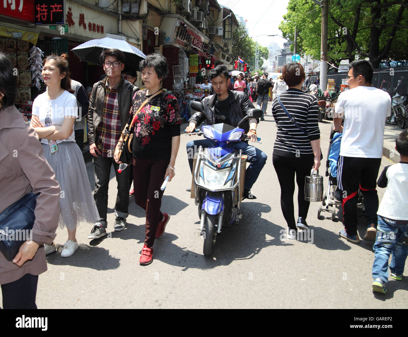 Chinese man riding scooter in High Resolution Stock Photography and ...