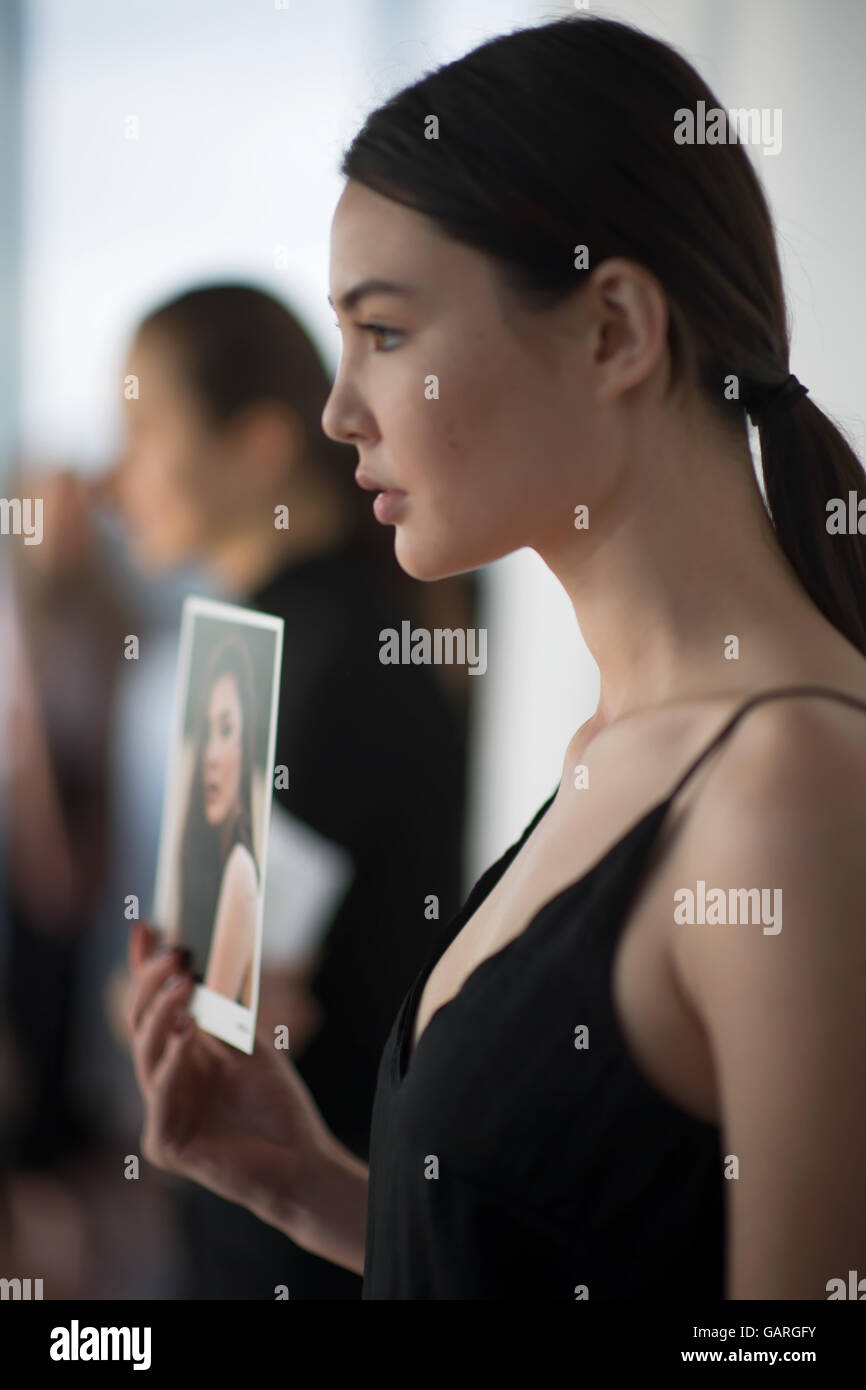 Australia. 05th July, 2016. A model holds her composite card as she is ...
