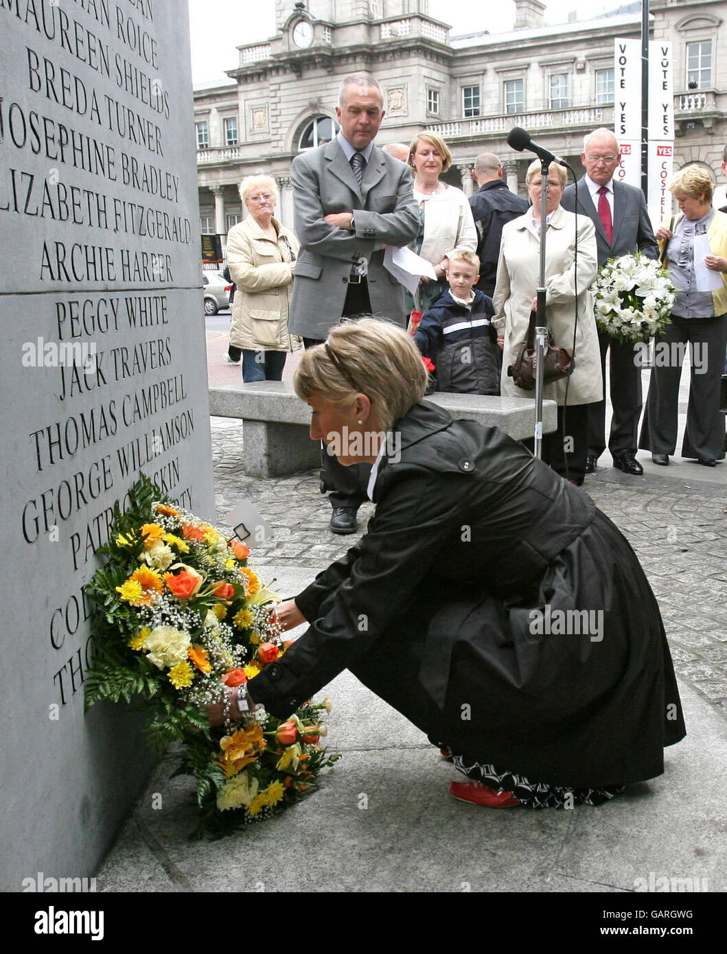 Aileen Murphy lays a wreath on behalf of campaign group Justice for the ...