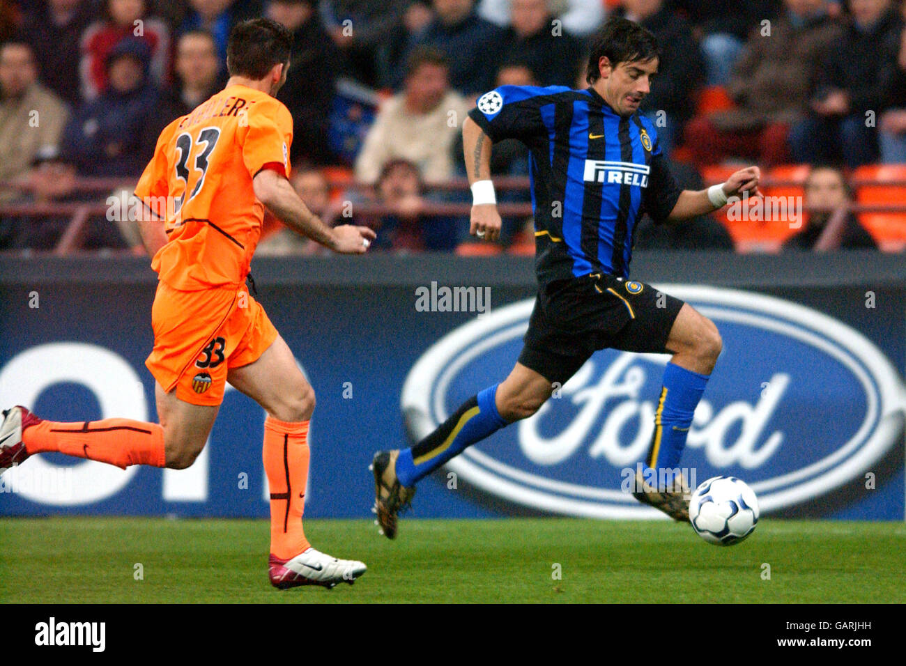 Inter Milan's Francesco Coco (r) takes on Valencia's Anthony Reveillere ...