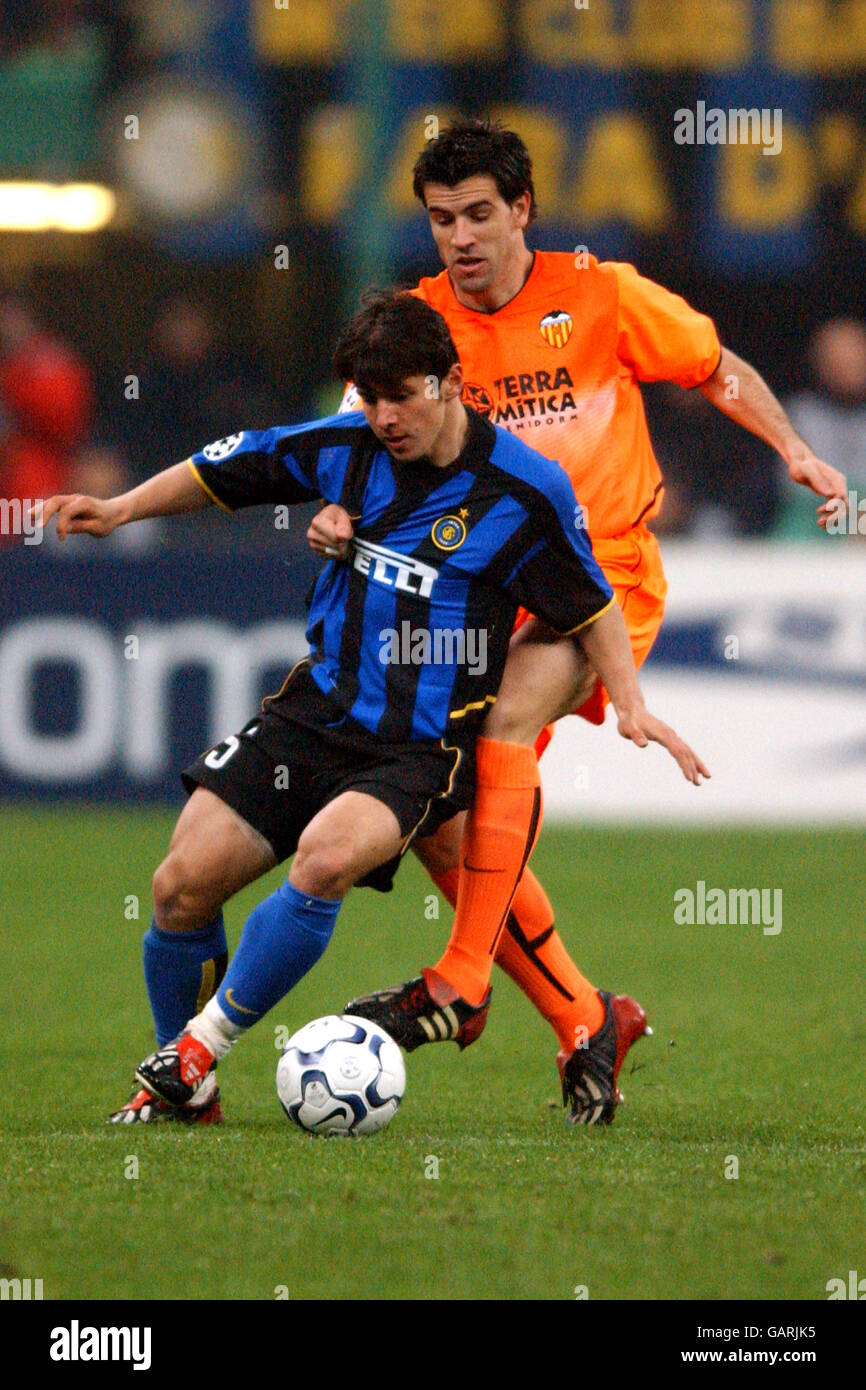 Inter milans emre shields the ball from valencias david albelda hi-res ...