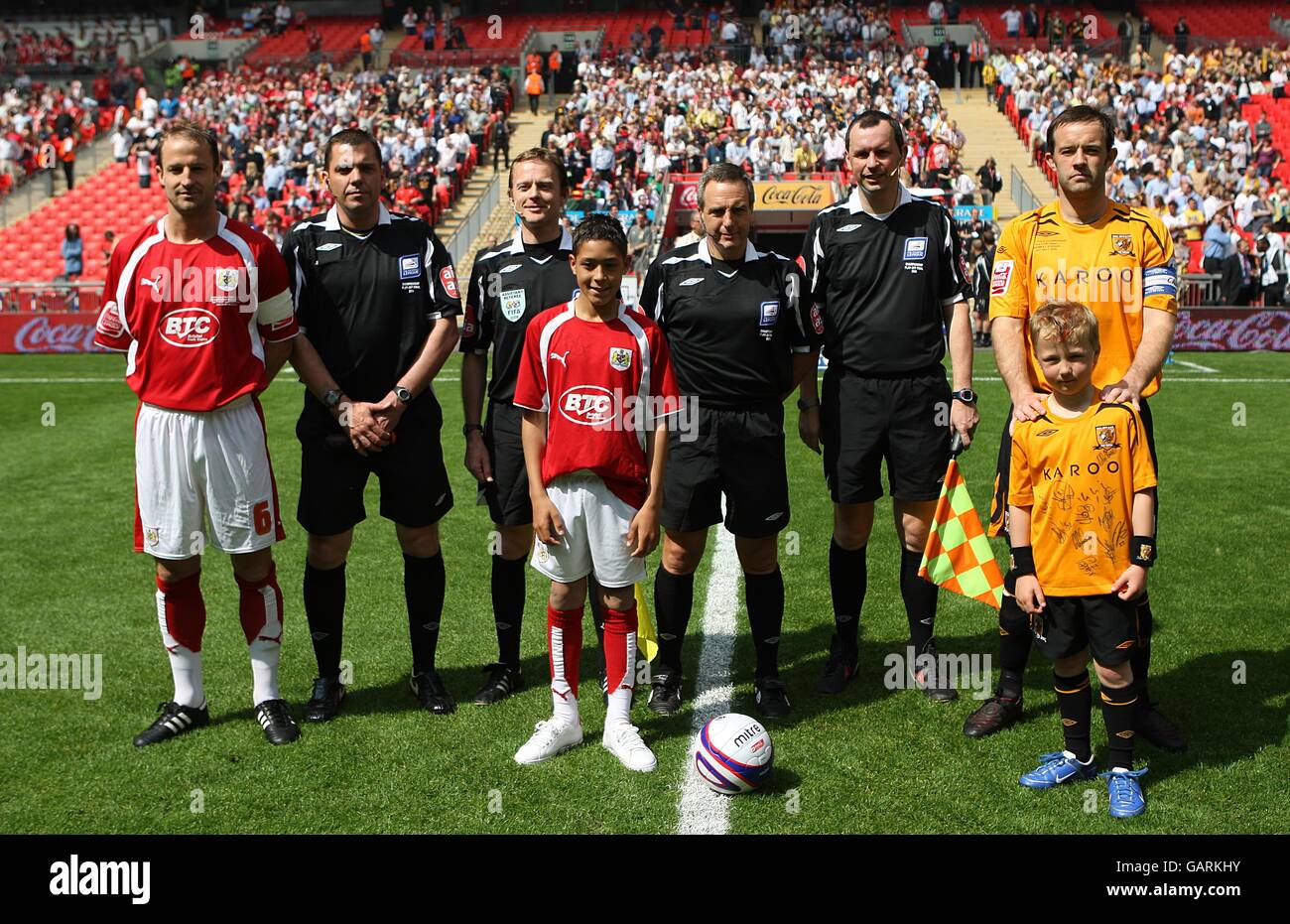 Bristol City captain Louis Carey (left) and Hull City captain Ian ...