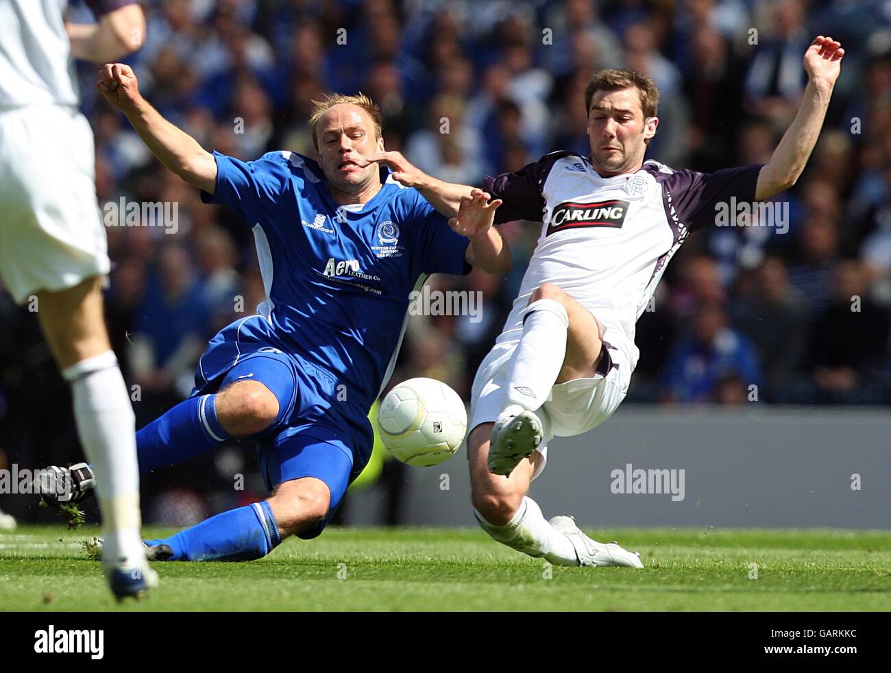 Queen Of The South's Neil MacFarlane (left) and Rangers' Kevin Thomson ...