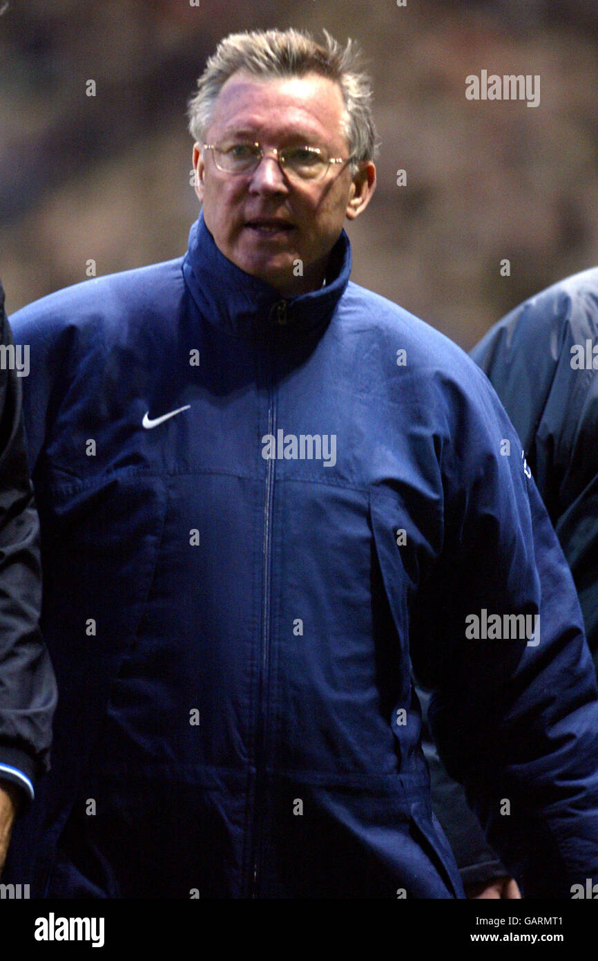 Manchester United manager Alex Ferguson walks off the field dejected ...