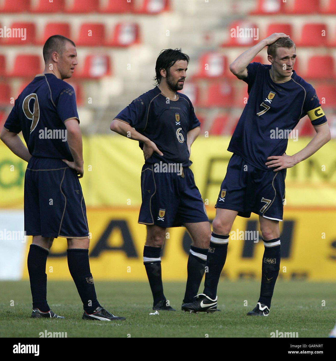 Scotland's (l-r) Kenny Miller, Paul Hartley and Darren Fletcher stand ...