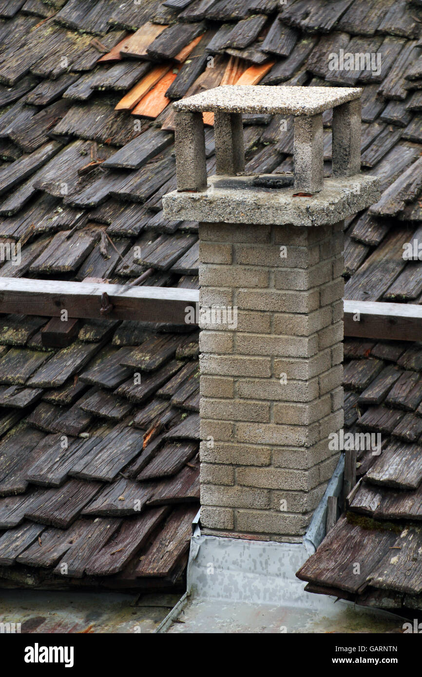 roof of wooden shingles and stone chimney Stock Photo - Alamy