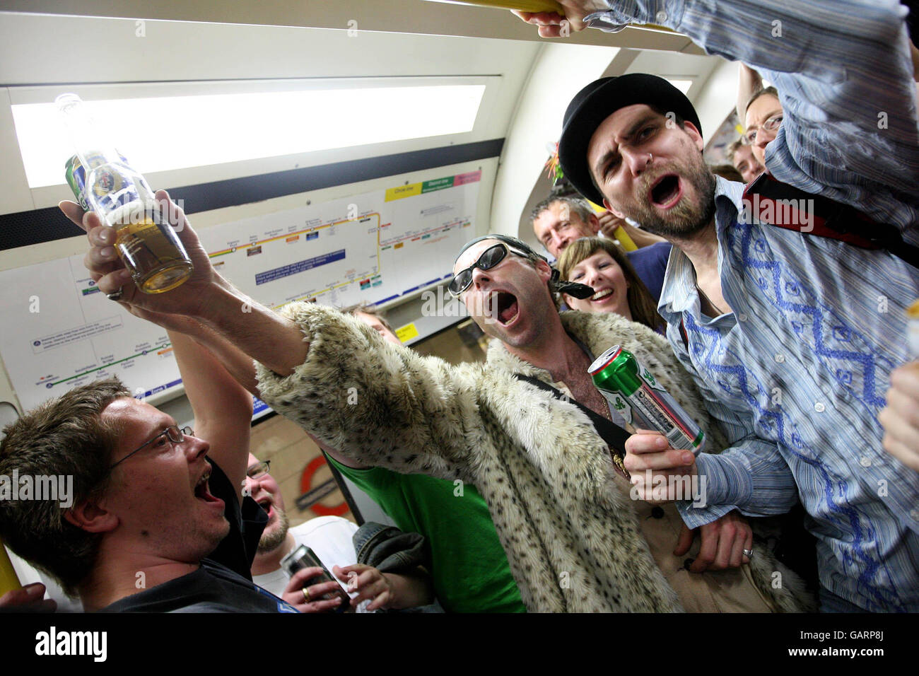 Revellers say farewell to drinking on the Tube Stock Photo - Alamy