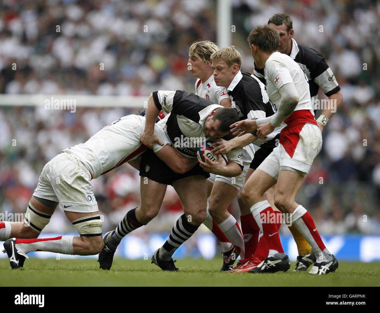 Barbarian's Mark Regan runs at the England defence during the ...