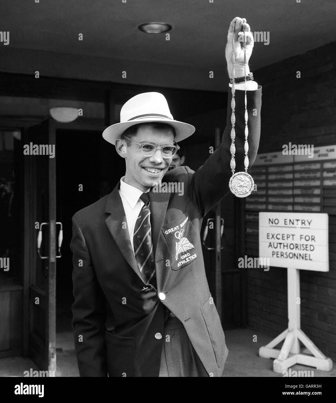 Don Thompson with his gold medal for the 50 kilometre walk, which he ...