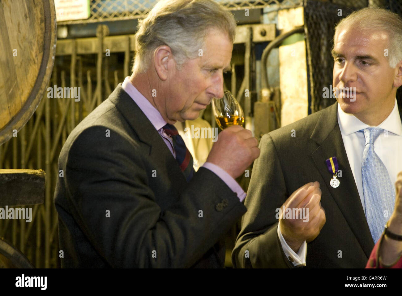 The Prince of Wales is given a tour by Beam Global CEO Tom Flocco ...