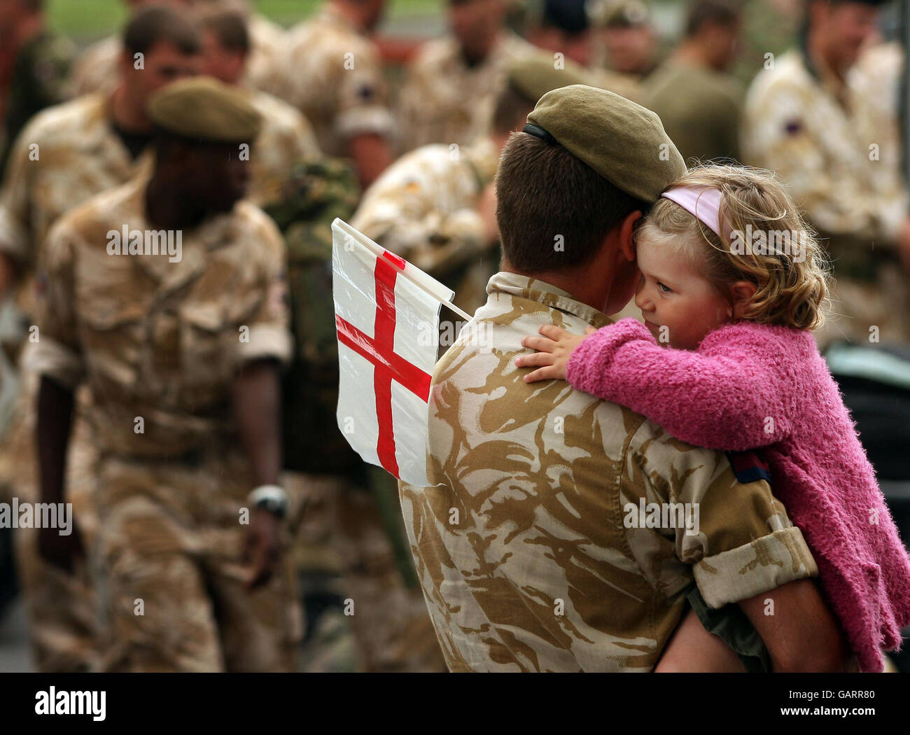 An unidentified soldier from the 1st Battalion Scots Guards receives a ...
