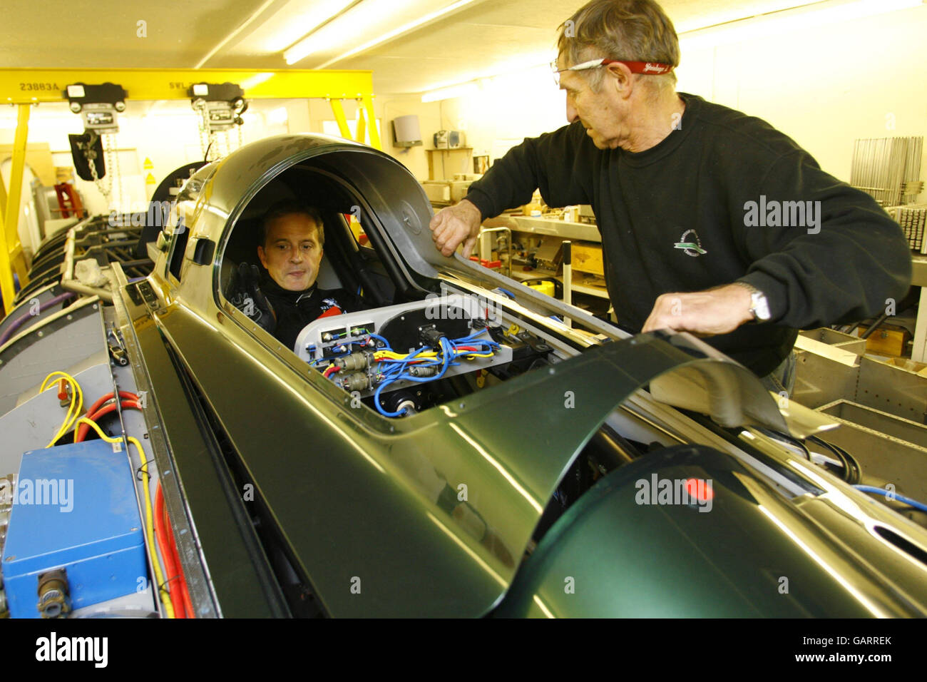 Test driver Don Wales tries out the cockpit of the British Steam Car ...