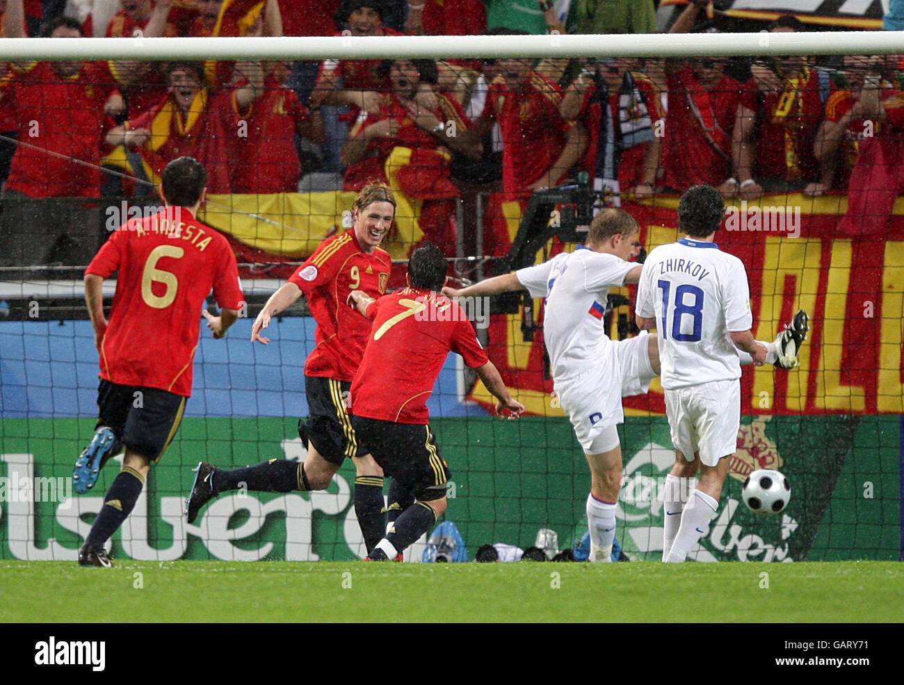 Spain's David Villa (7) celebrates with his team mates after scoring ...