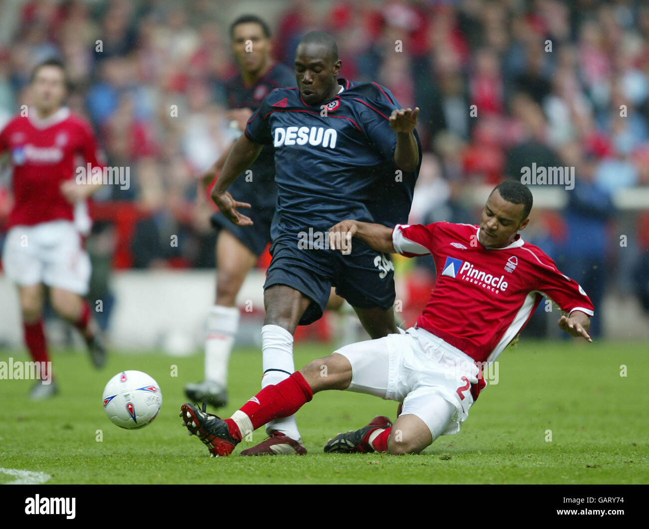 Nottingham Forest's Mattieu Louis-Jean tackles Sheffield United's Steve ...