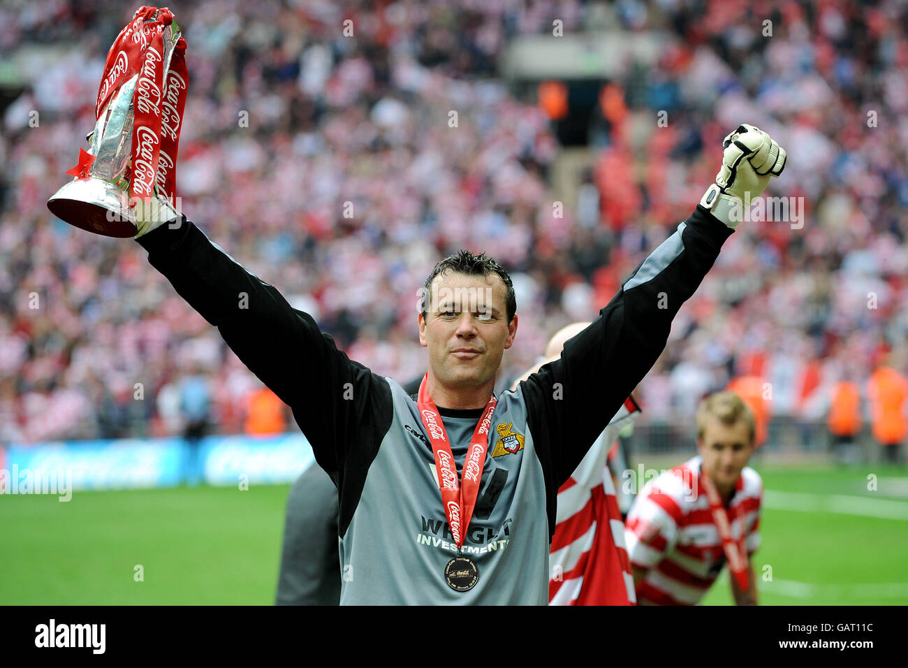 Doncaster rovers goalkeeper neil sullivan celebrates with the trophy hi ...