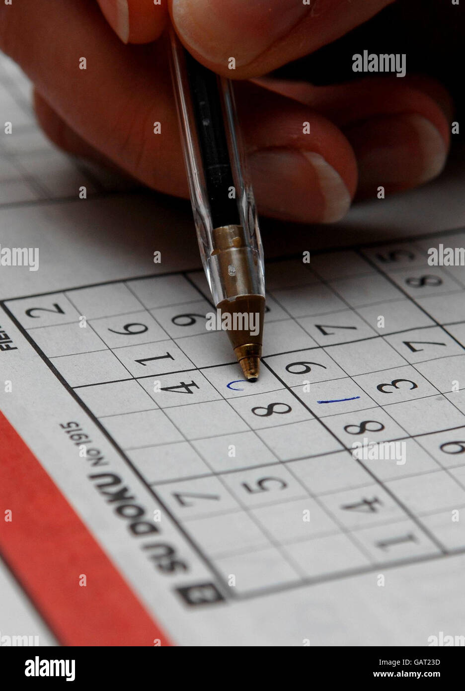 Generic photo of a su doku puzzle being completed with a ball point pen ...