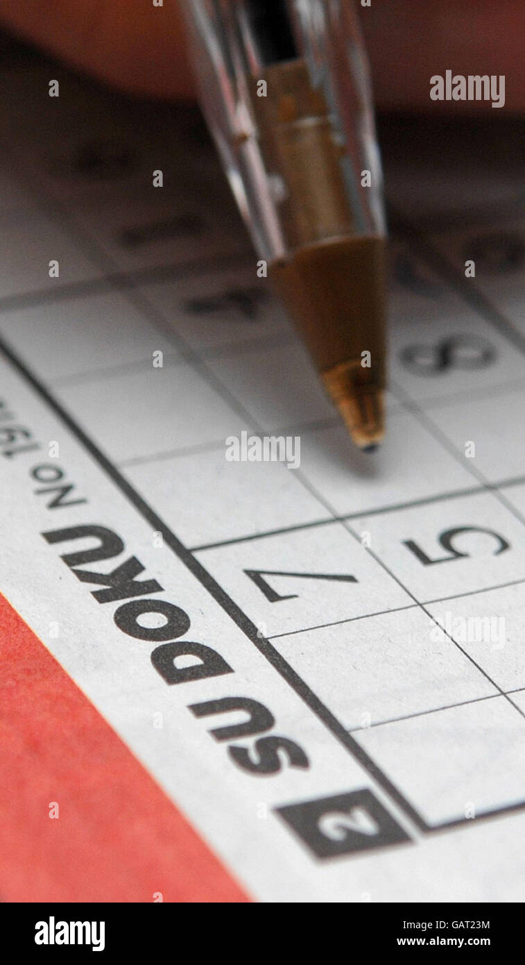 Generic photo of a su doku puzzle being completed with a ball point pen ...