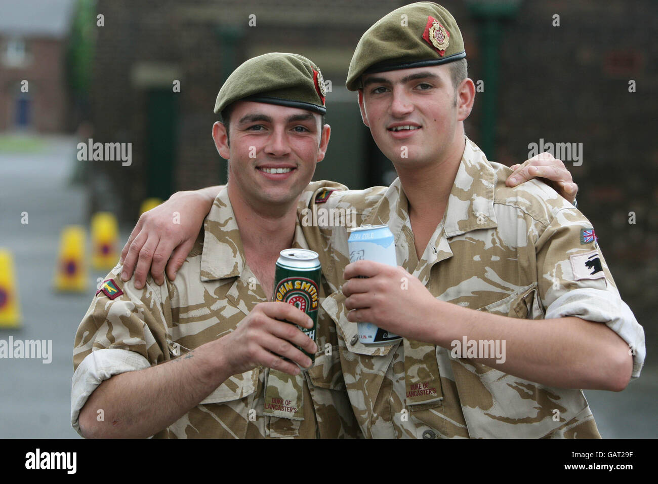 Brothers Steve Riches, 21 (left) and Ben Riches, 19, enjoy a beer on ...