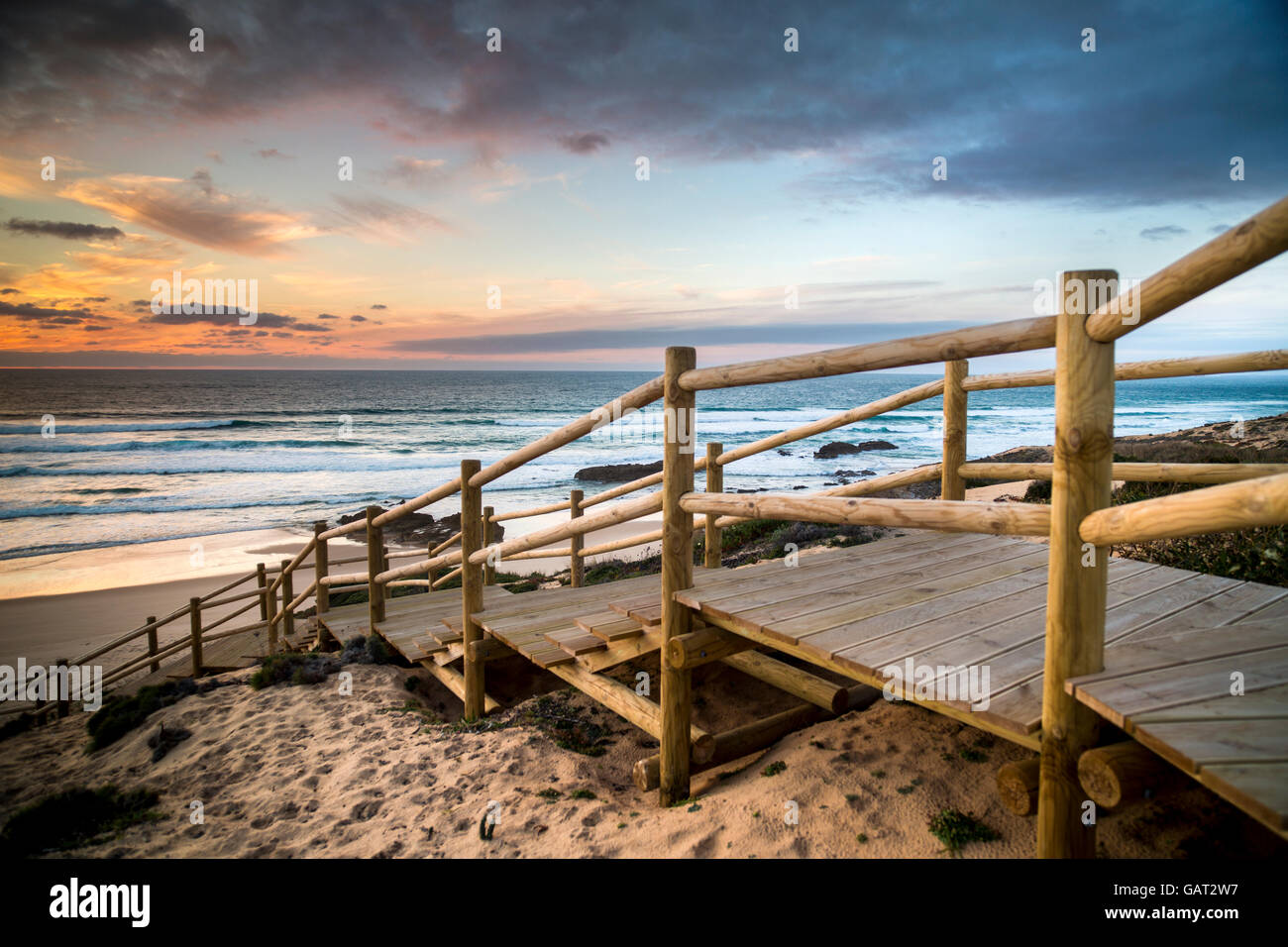 wooden steps leading down to a beautiful wild and deserted beach on ...