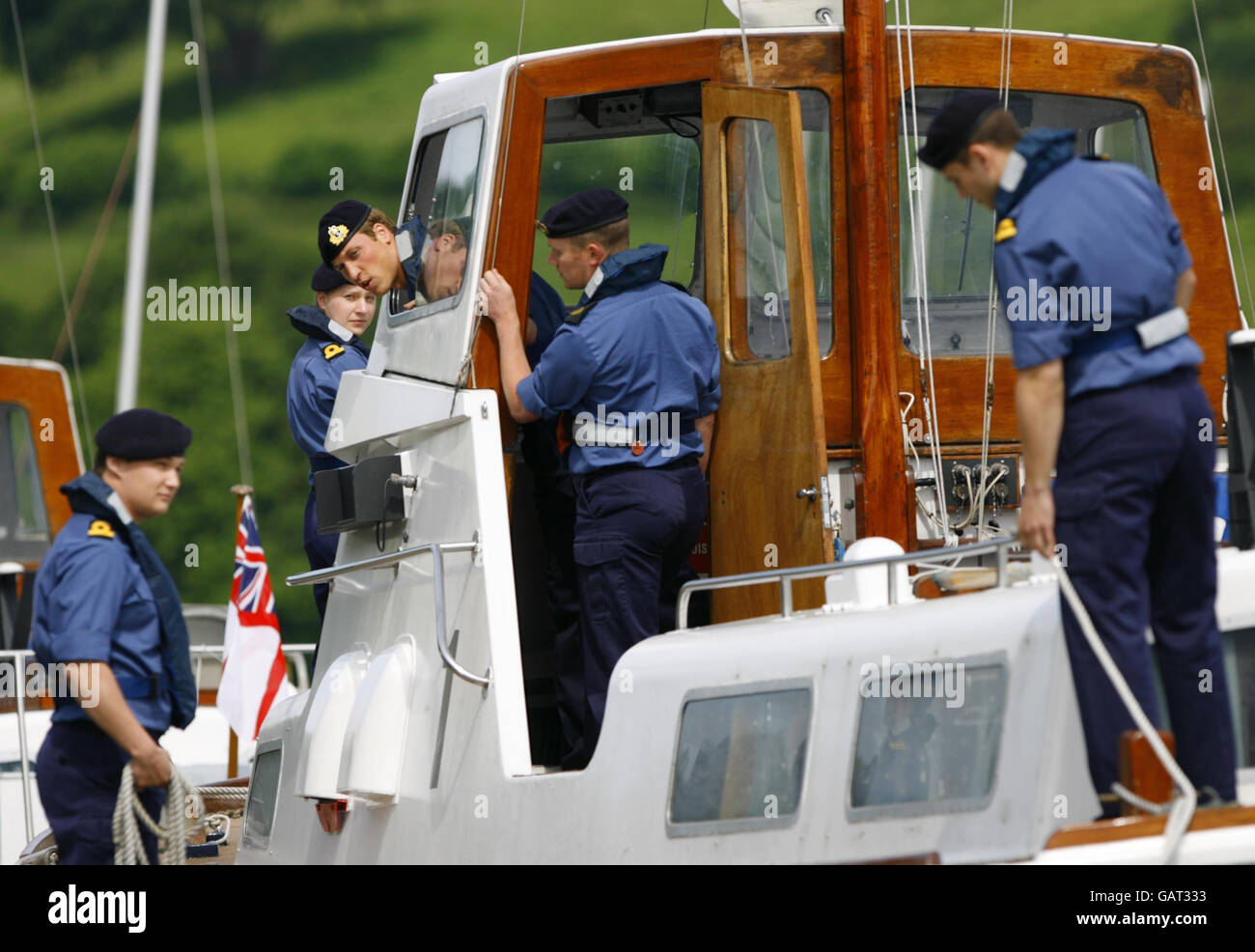 Prince William looks out the window of a training boat in Dartmouth ...