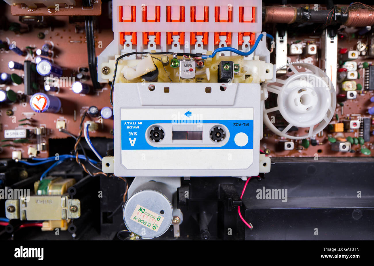 old tape cassette inside a broken hifi system Stock Photo - Alamy
