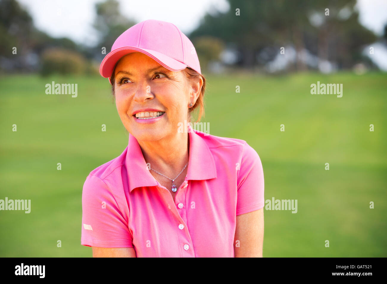 beautiful senior female golf player on a golf course Stock Photo - Alamy