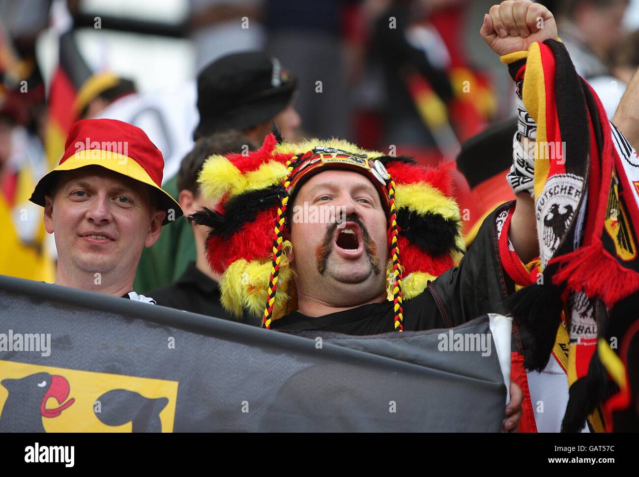 A German fan shows his support, inside Hypo-Arena prior to kick off ...