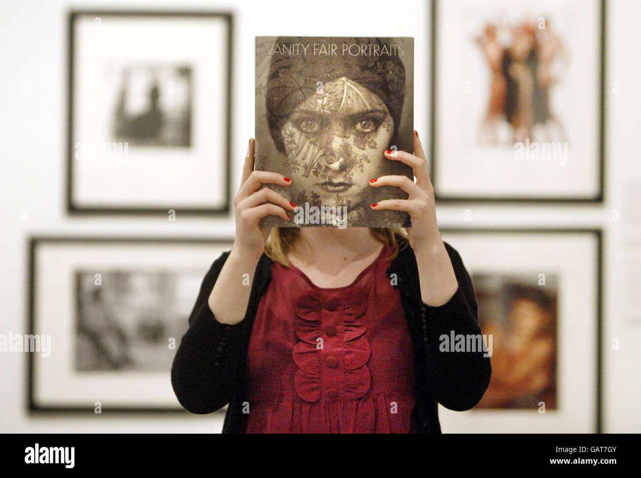 Gallery employee Grace Murray-Cavanagh with a Vanity Fair Portraits ...