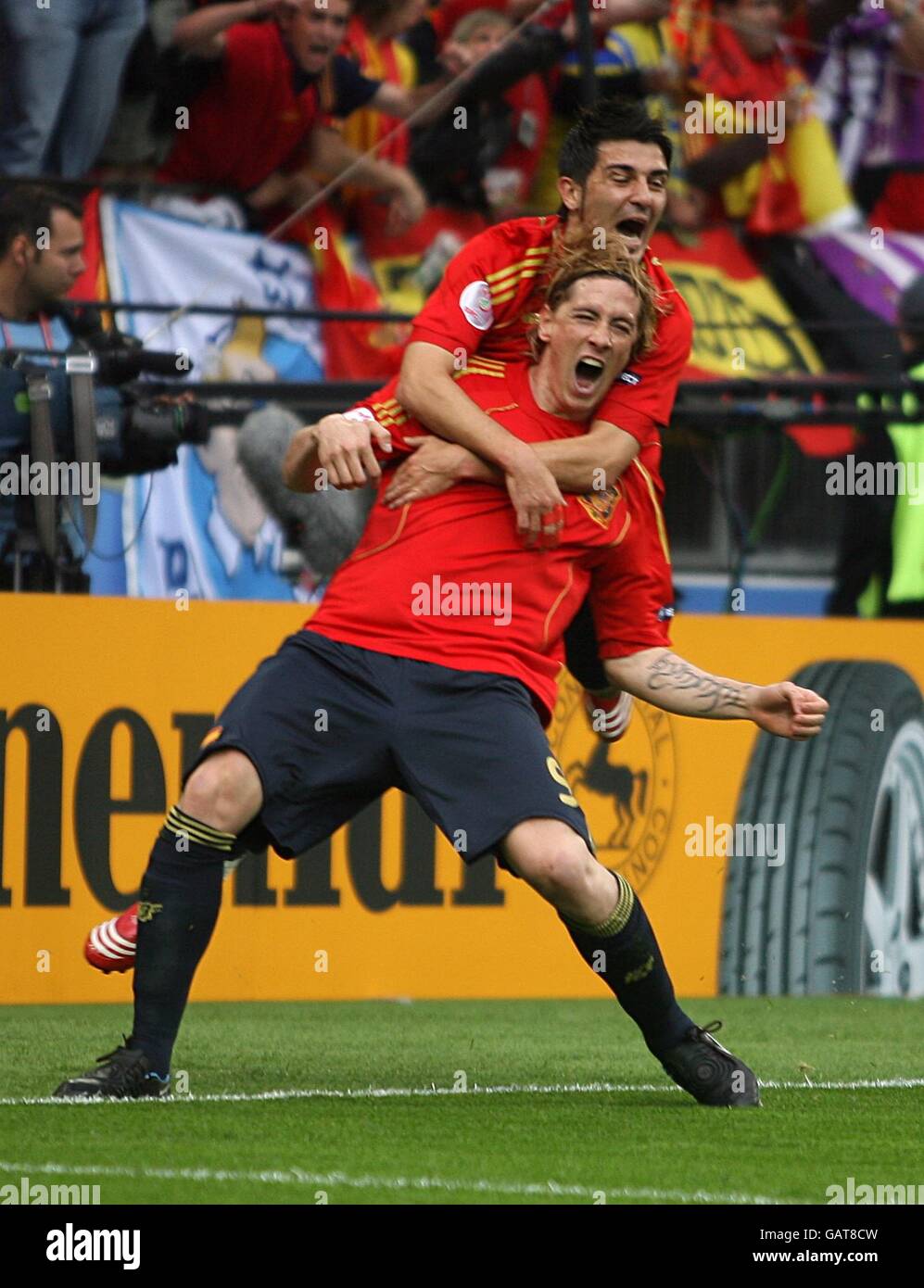 Spain's Fernando Torres (foreground) celebrates scoring his sides first ...