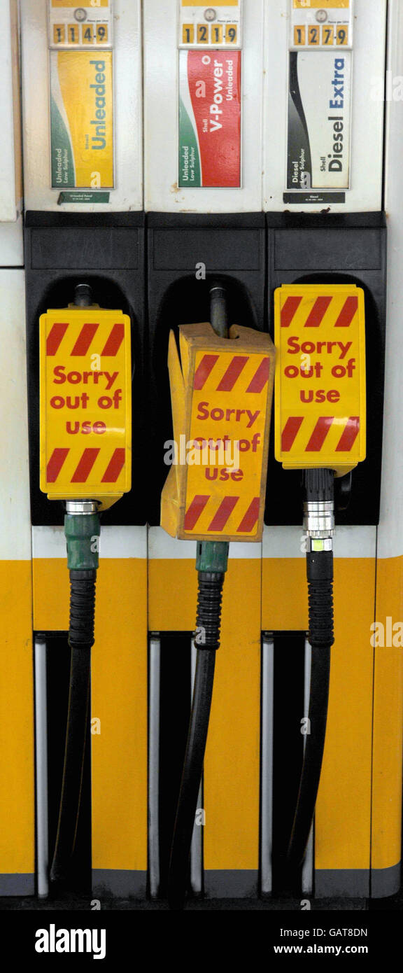 Signs cover the petrol pumps at a Shell filling station in Brighton ...