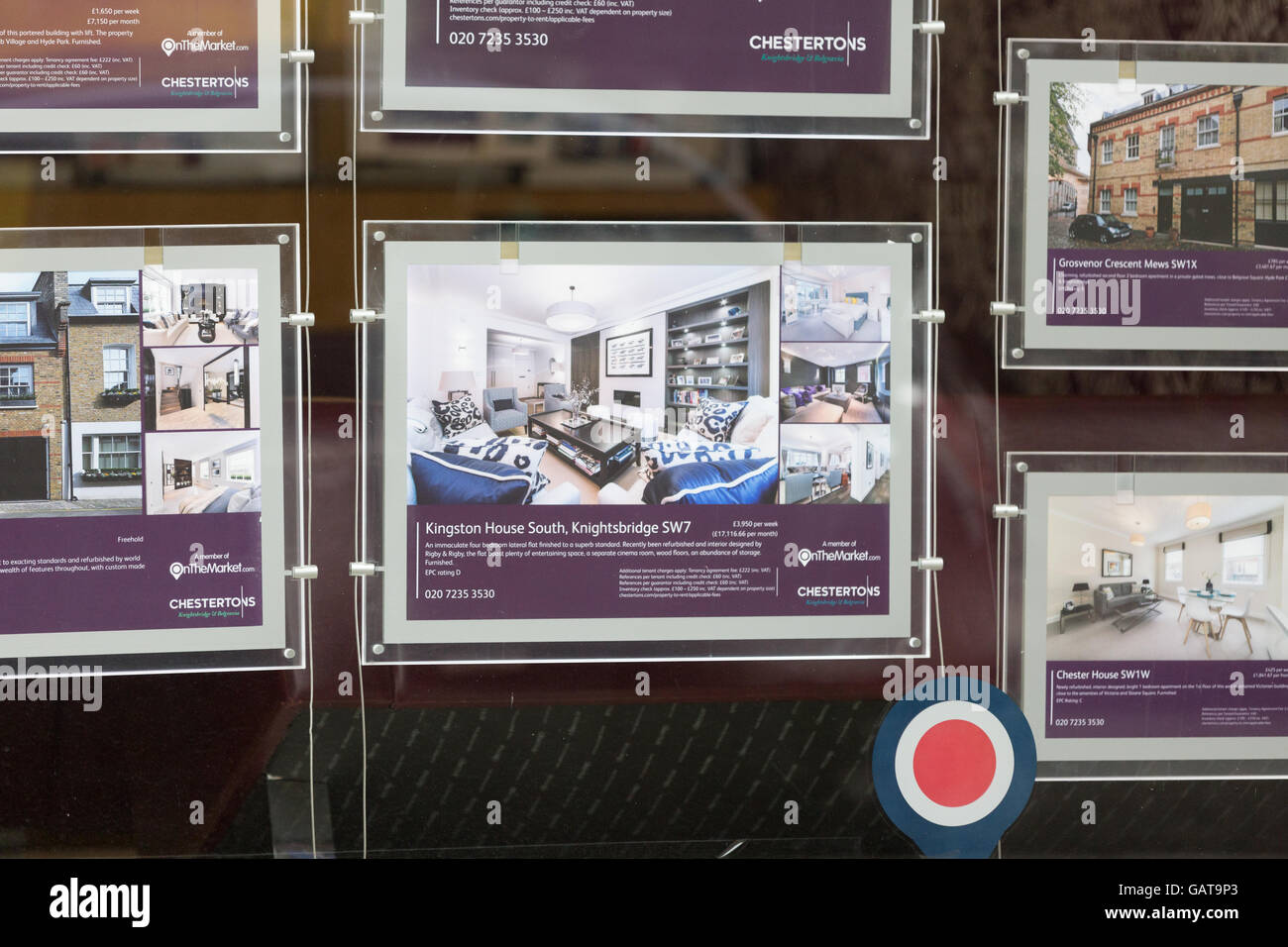 An estate agent window in Belgravia Stock Photo - Alamy