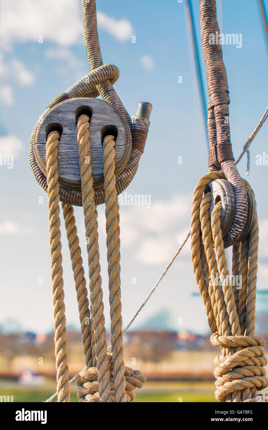 Vintage marine ropes and wooden tackle block on sailing vessel Stock ...