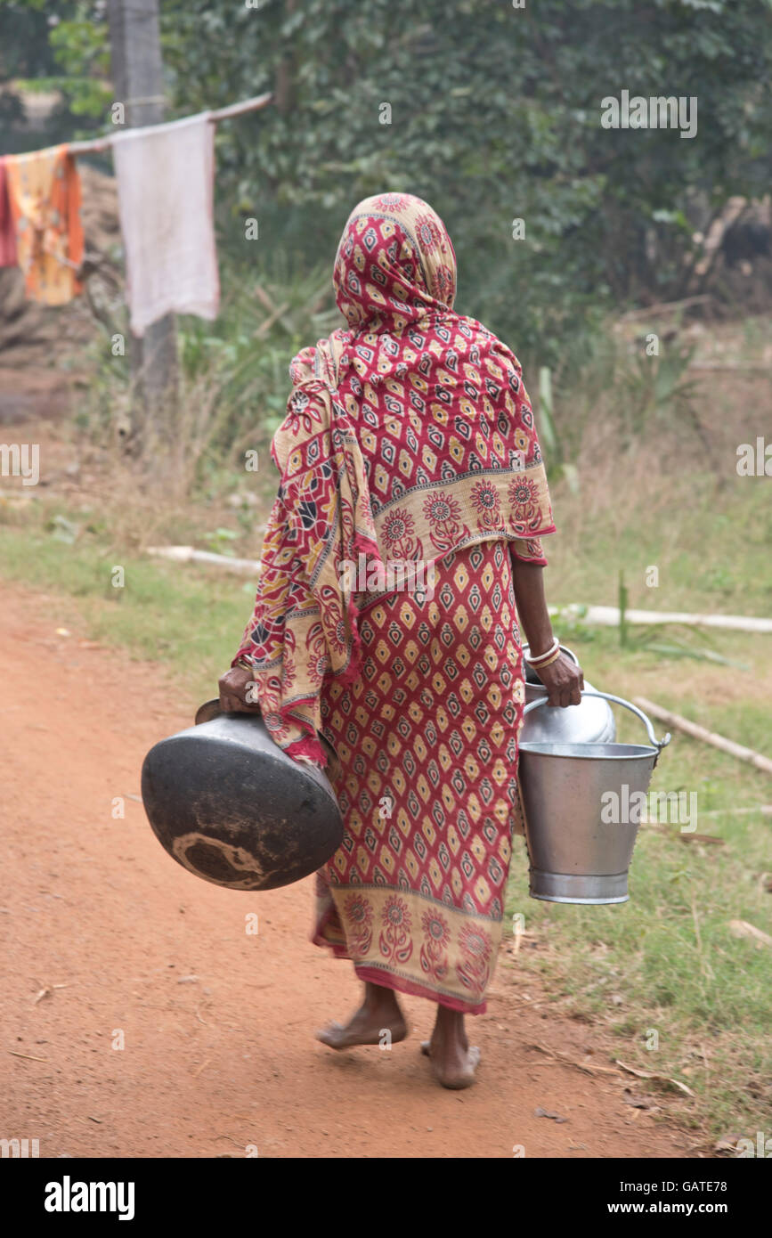 India woman fetching water hi-res stock photography and images - Alamy
