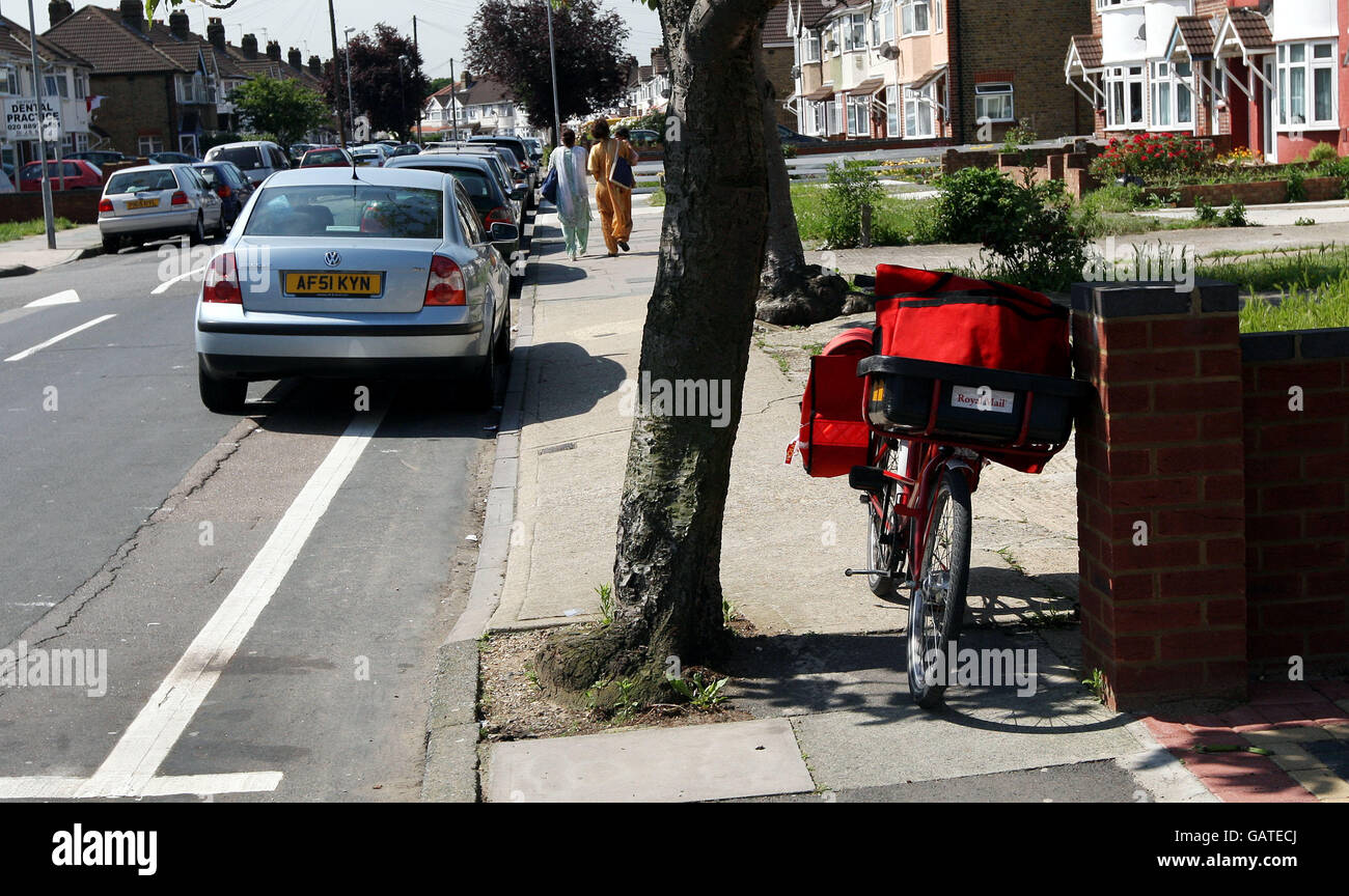 Postman's Bike. A postmans bike learns up against a wall during the ...