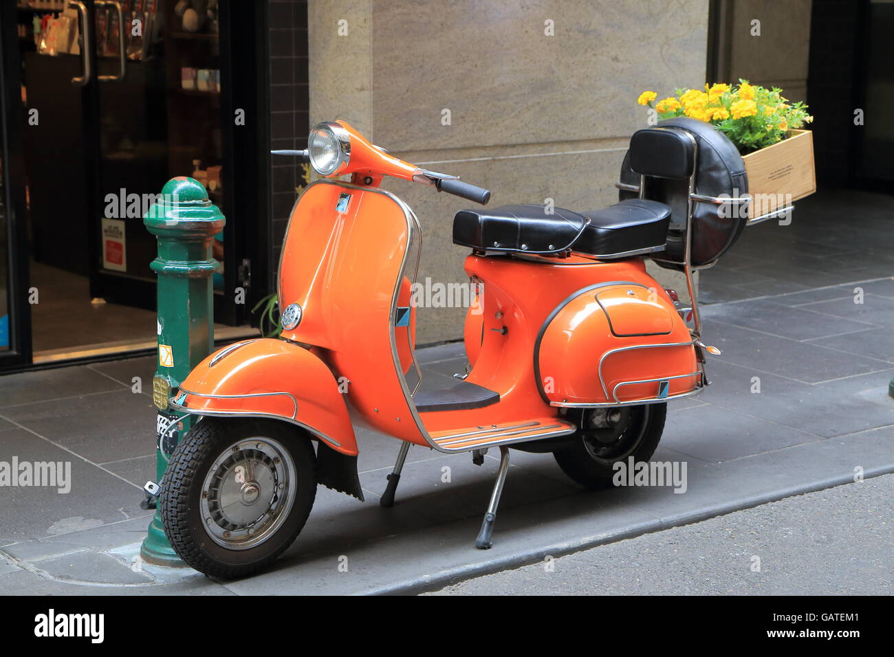 Orange scooter Vespa motorbike Stock Photo - Alamy
